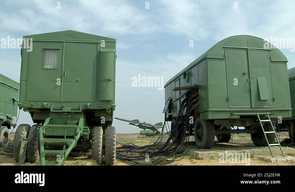 Rocket launcher and two military trailers Stock Video Footage - Alamy