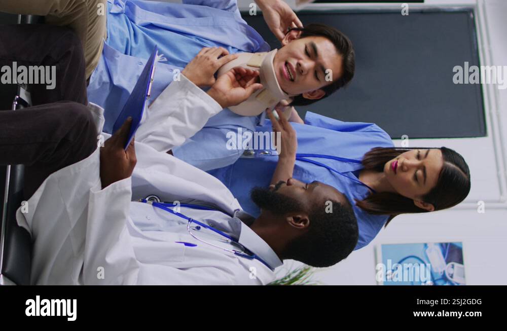 Vertical video: Medical staff helping injured patient Stock Video ...