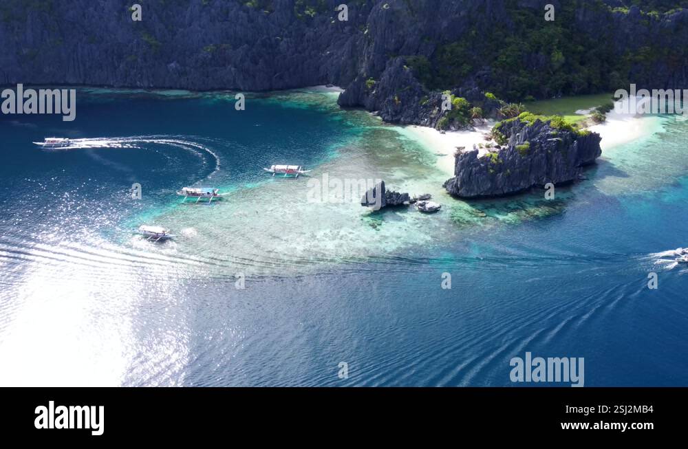Tourist Boats traffic docking and leaving Star Beach on tapiutan island ...