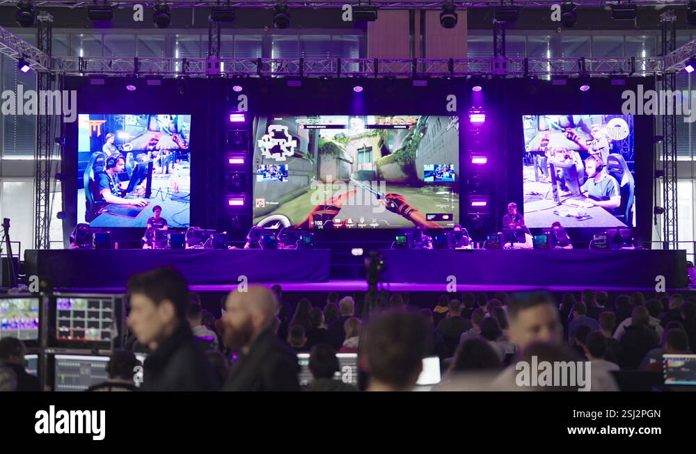 Live gaming tournament event stage with 5on5 players and crowd watching ...