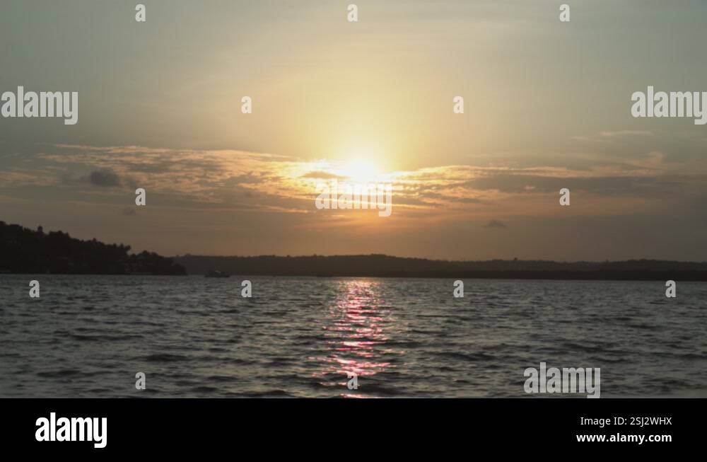 Red sunsets over sea video 4K. The sun touches the horizon. Red sky ...
