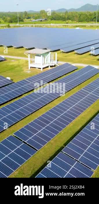 Rows of solar panels gleam under the sun at a solar park in Thailand ...