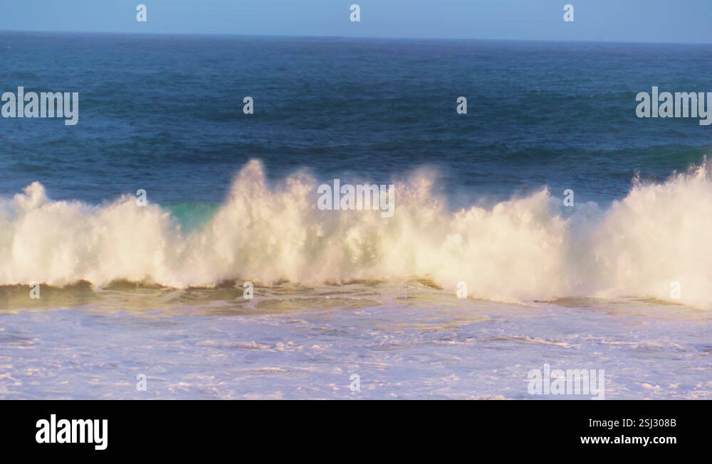 Morning ocean wave rolling towards shallow in super slow motion. White ...