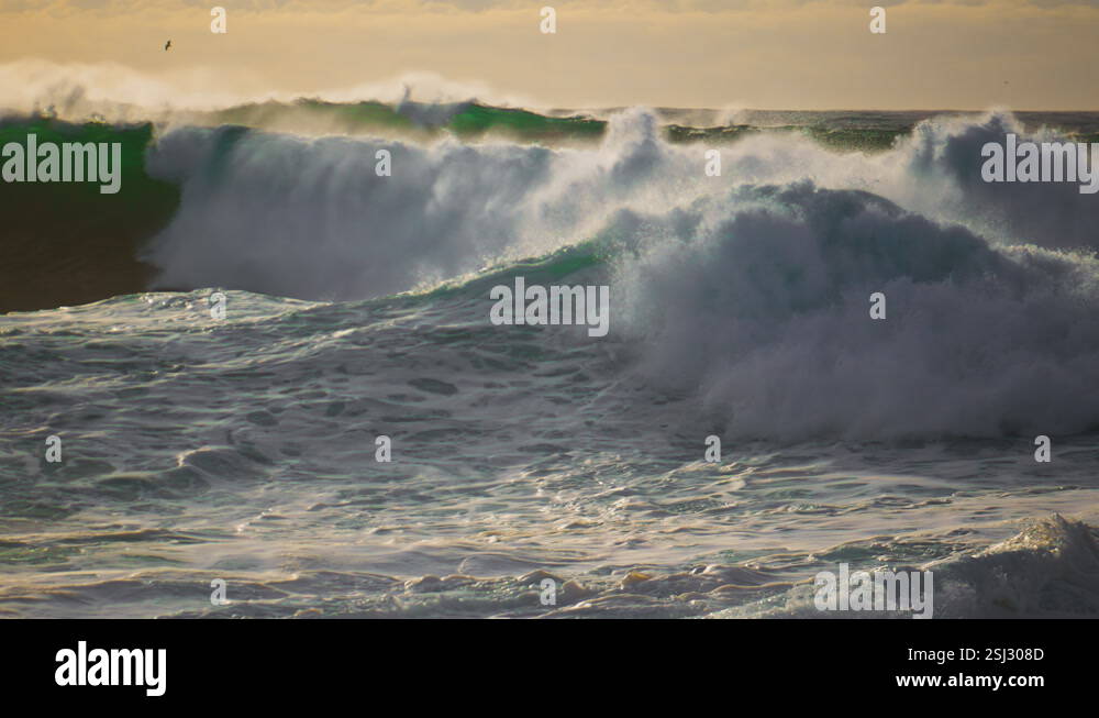 Dramatic stormy ocean waves splashing on sunny day. Extreme seashore ...