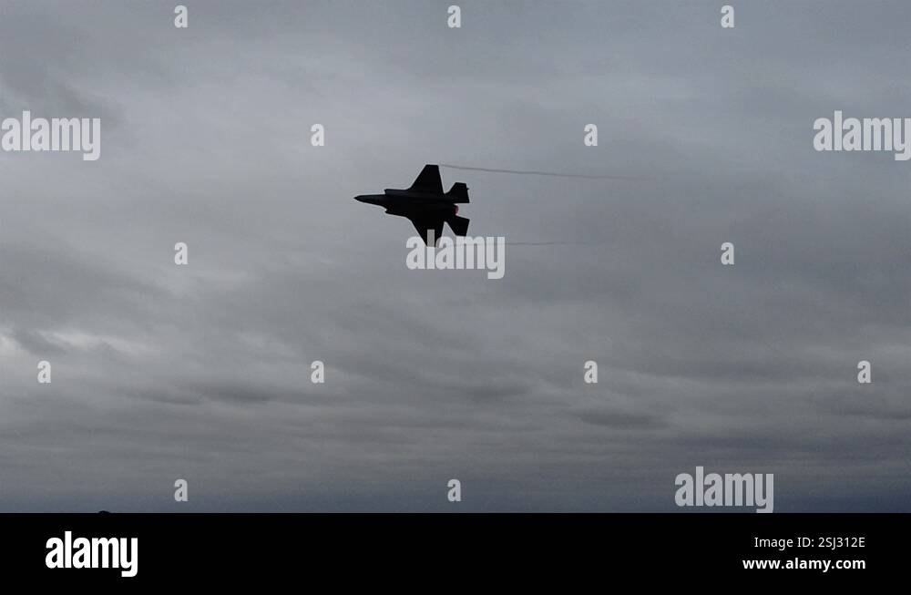 Lockheed Martin F-35 Lightning II Flying Around Cloudy Sky - low angle ...