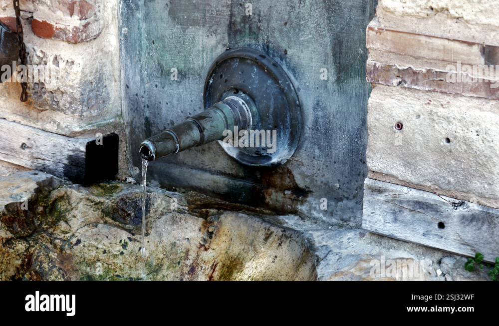 Fresh mineral spring water flows freely from towns drinking fountain ...