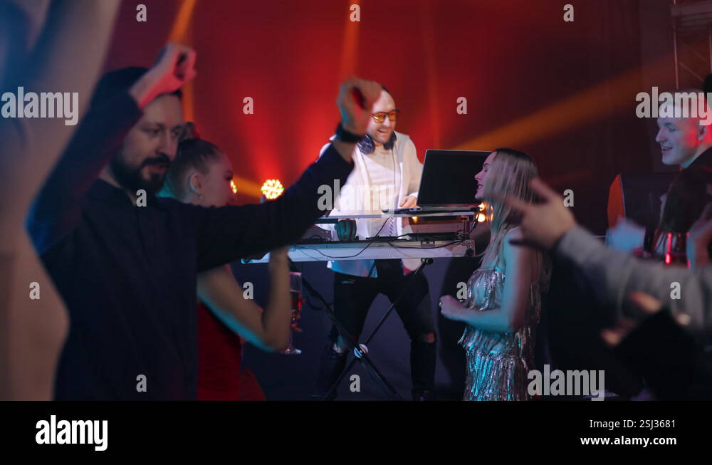 Clubbing people dancing on crowded dance floor famous DJ live ...
