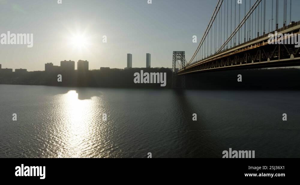 Ascending aerial view of traffic on two levels of the GW bridge, sunset in Stock Video Footage ...
