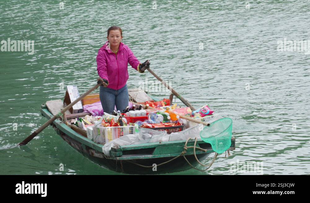 Vietnamese Lady Rowing Boat With Drinks And Wine To Tourists. - wide ...