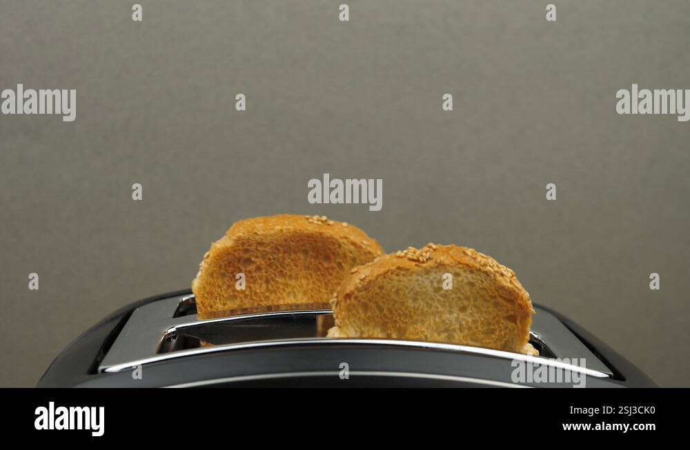 Fried toast bread pops out of a modern toaster, slow motion Stock Video Footage - Alamy