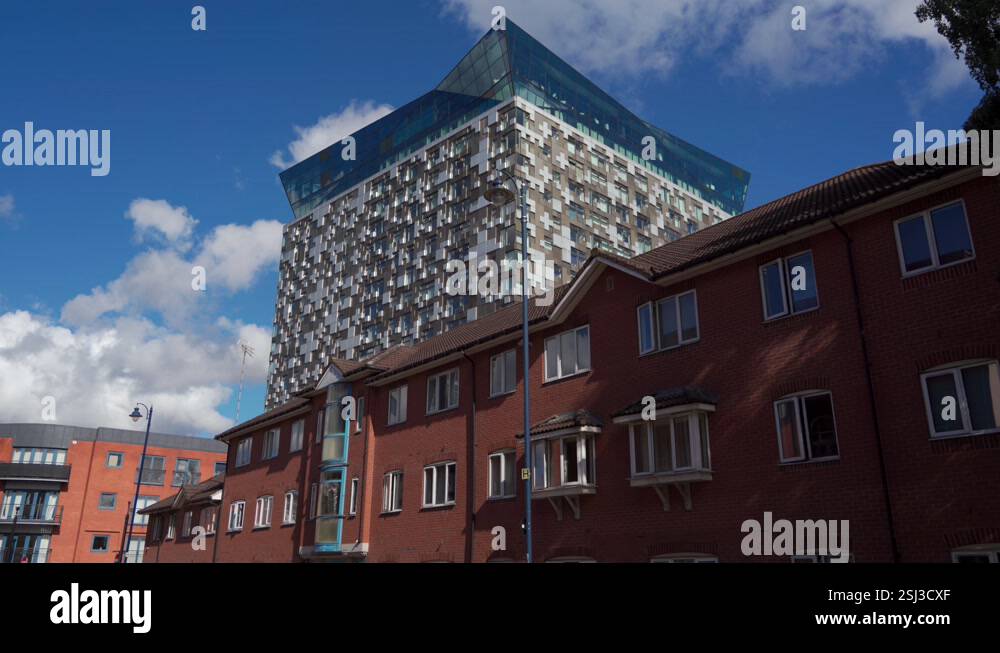 Birmingham UK city centre background with the Cube building and homes ...