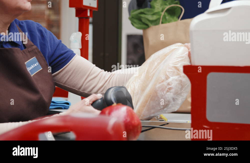 Cashier Checking Goods with Scanner Stock Video Footage - Alamy