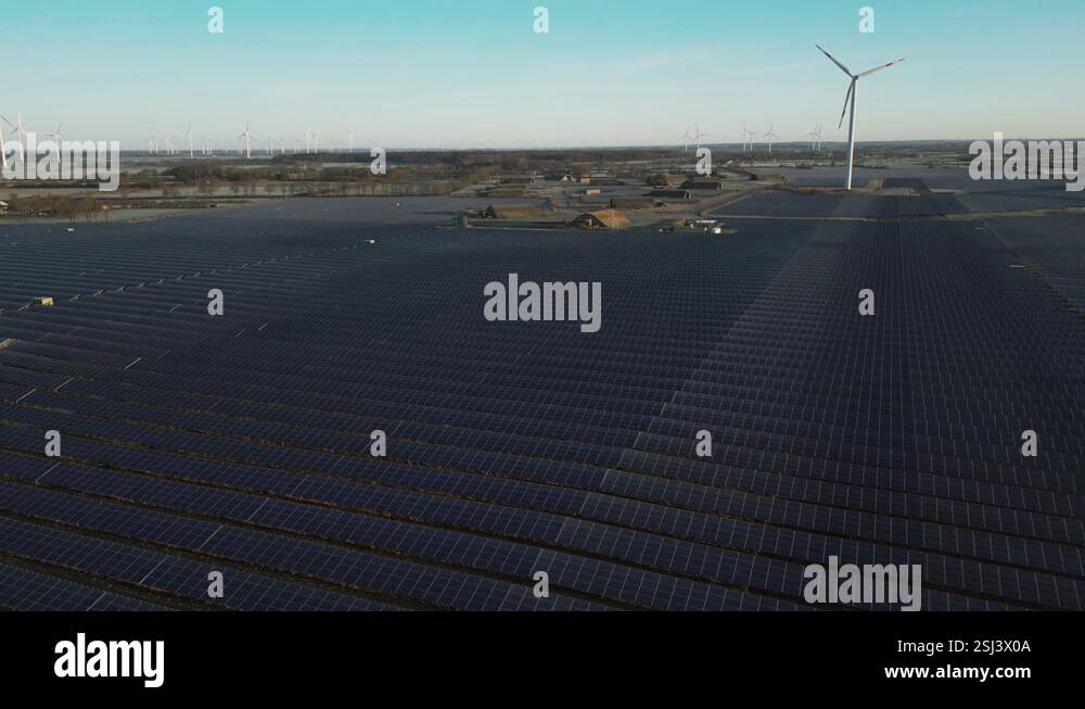 Aerial footage shows a wind and solar farm with modern infrastructure ...