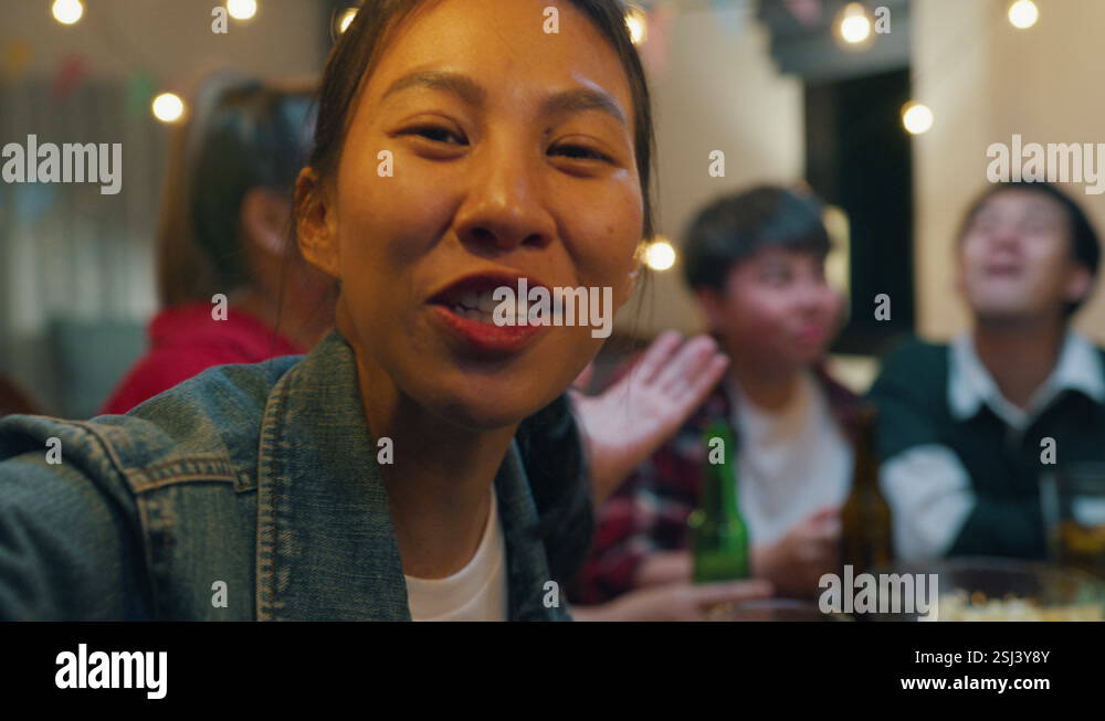 Asia people use phone greeting friend on remote video call and having ...