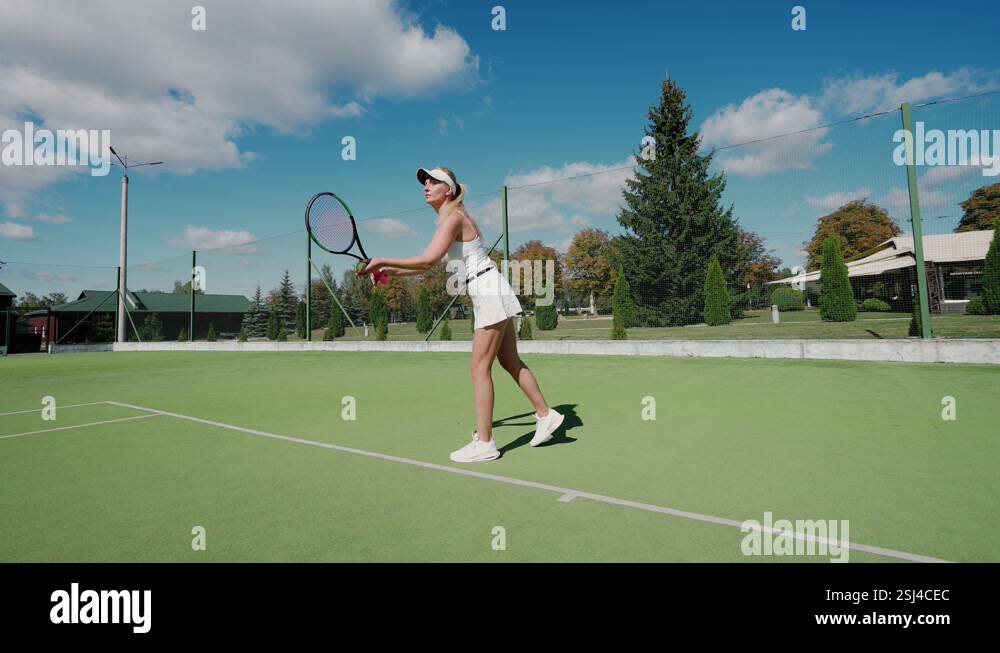 Pro tennis player hits the ball with a racket, practice game on the ...