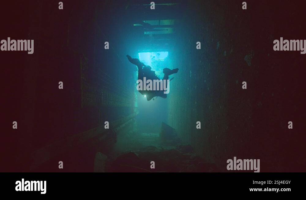 Scuba diver swims to exit inside cramped hold of ferry Salem Express ...