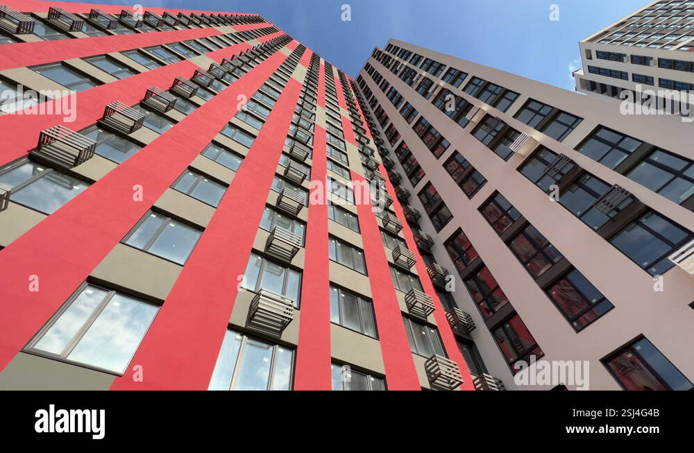 Bottom up view of a newly built modern high-rise apartment building ...