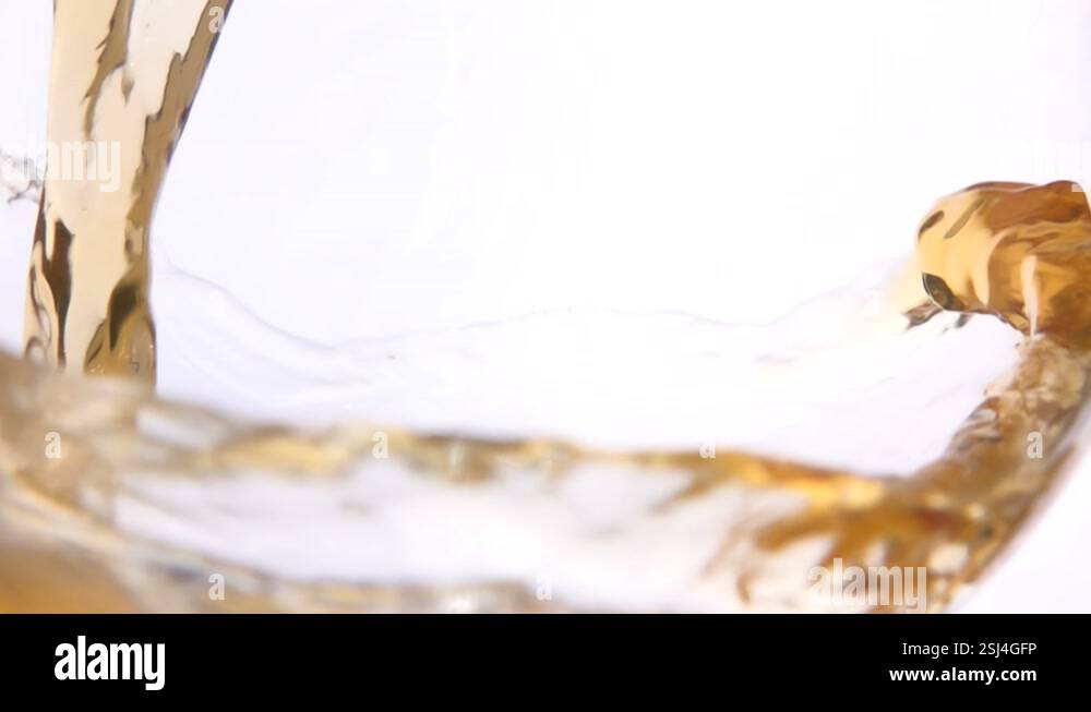 An appetizing wave of white grape juice swirls inside the glass Stock ...