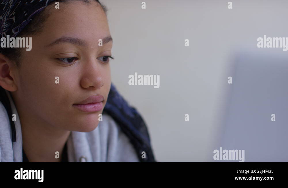 Young girl scrolling on her trackpad of her laptop computer Stock Video ...