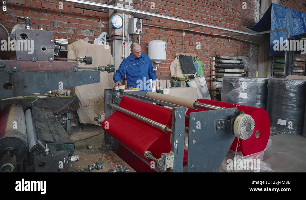 Worker Removes Shaft Detail From Machine And Inserts Into Fabric ...