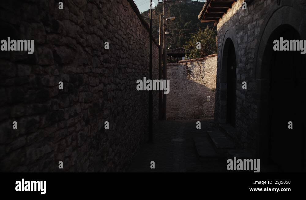 Walking through a dark alley in Berat, Albania Stock Video Footage - Alamy