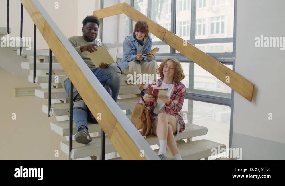 College Students Sitting On Stairs Stock Video Footage - Alamy