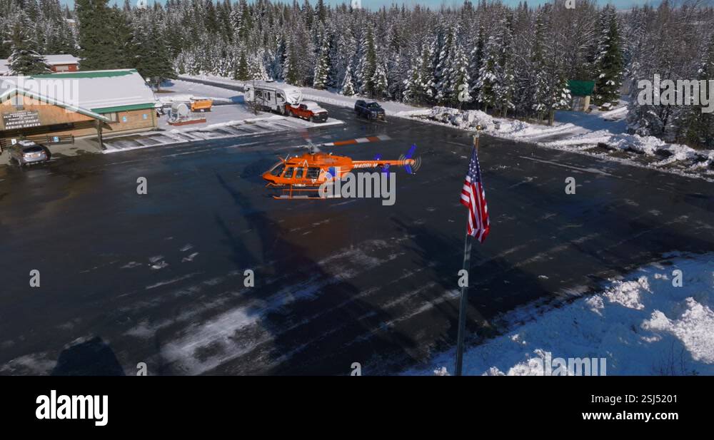Drone footage of a helicopter taking off from an emergency response ...