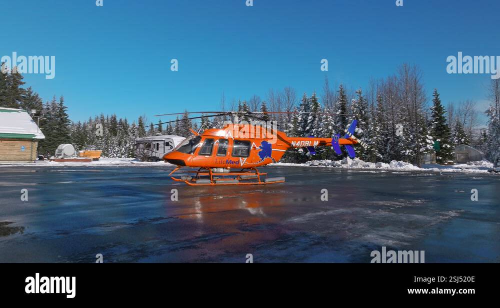 Drone footage of a helicopter taking off from an emergency response ...