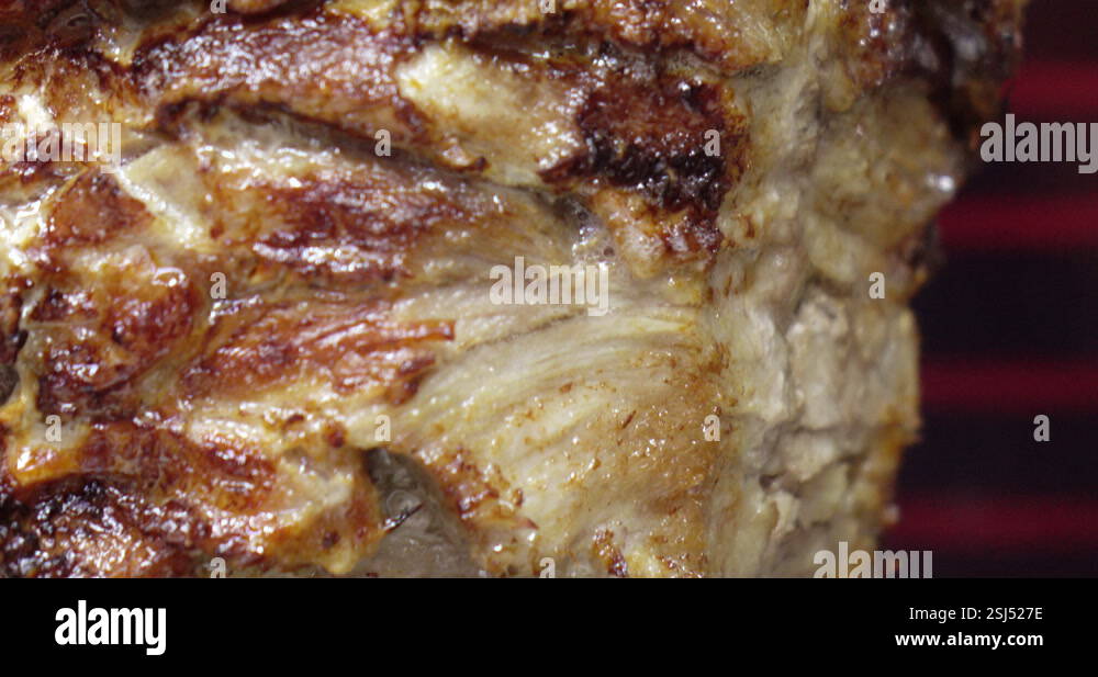 Meat on a spit . Cooking doner kebab or shawarma on a rotating vertical ...