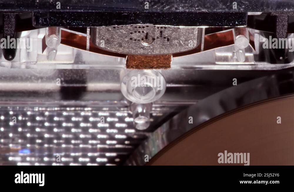 A macro top view of a playback head cassette tape. An analog magnetic ...