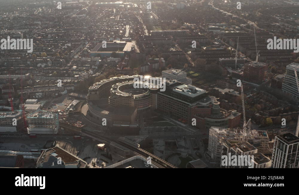 Slow establishing aerial shot of BBC television centre building ...