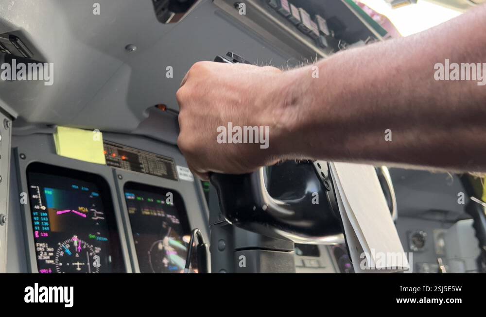 Airplane cockpit inside view from the left side. Captain flying. Modern ...