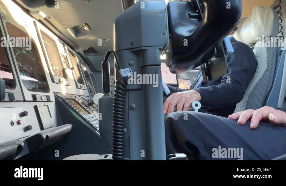 Airplane cabin from inside. Modern jet cockpit view during a real ...