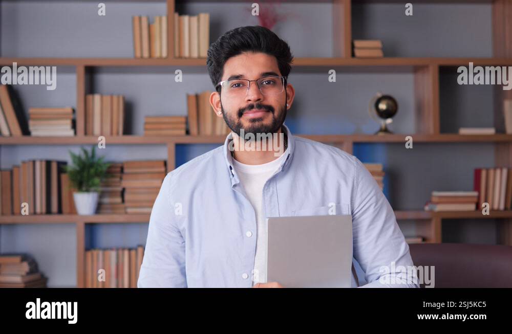 Eastern male professional executive , manager poses in an office ...
