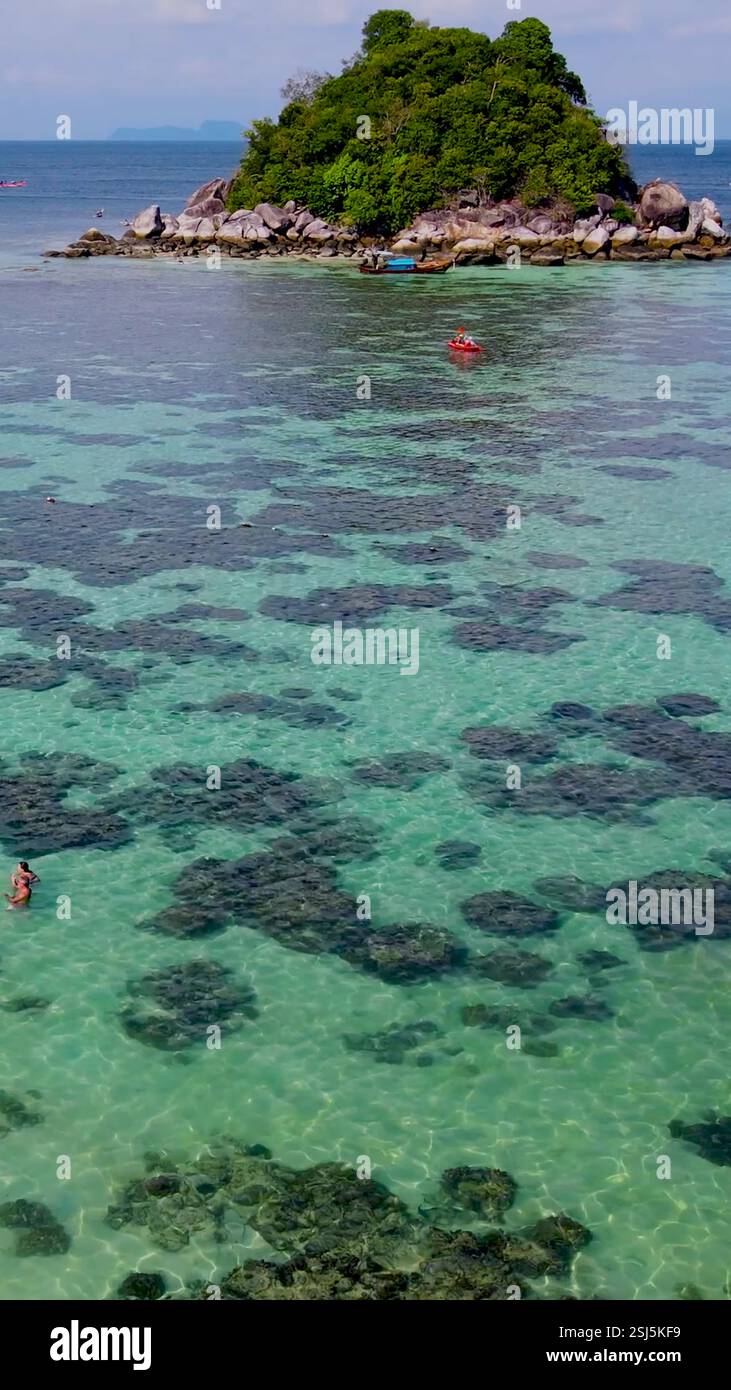 people kayaking in the ocean of Koh Lipe Thailand, kayak at a coral ...