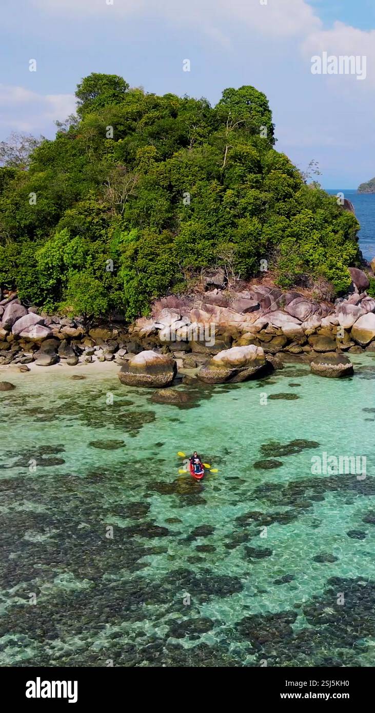 people kayaking in the ocean of Koh Lipe Thailand, kayak at a coral ...