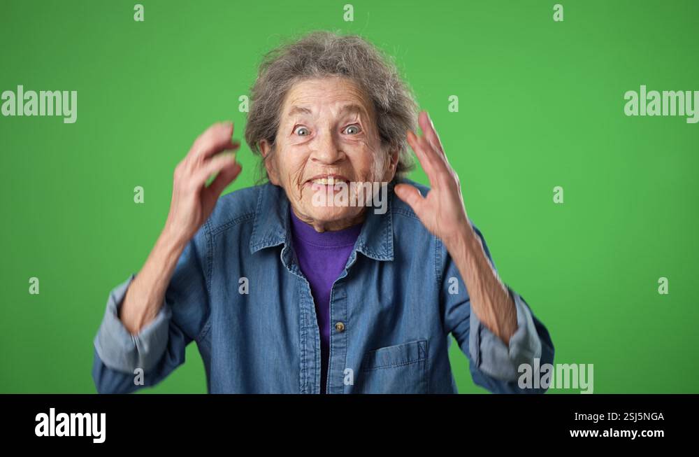 Portrait of elderly senior old woman with wrinkled skin and grey hair ...