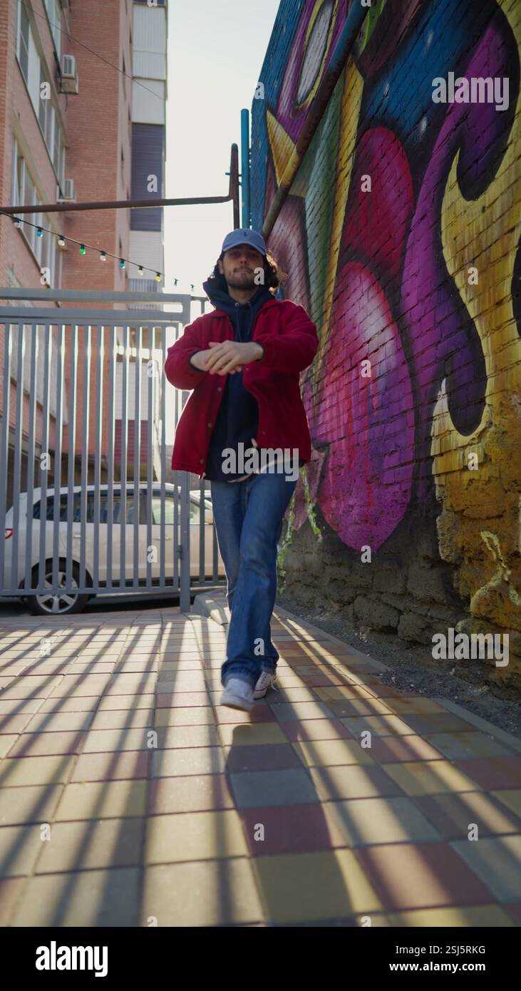 Vertical Video, Street Dancer Dances a Modern Hip Hop Dance in a Red ...