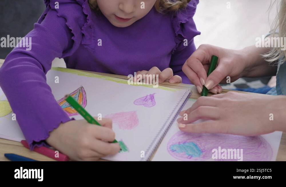 art class for child creative hobby. Teacher helping Pre School Pupil ...