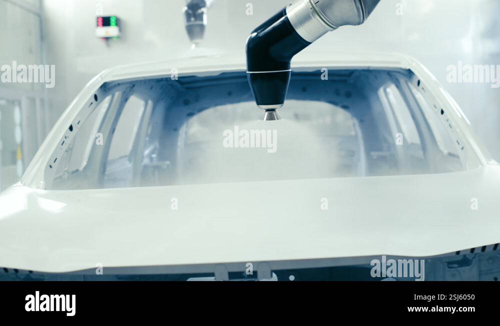 Robotic Arms Spray Painting a Vehicle Body at a Car Manufacturing ...