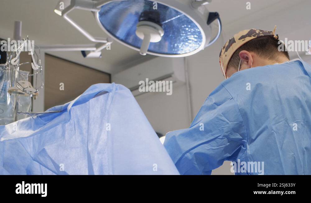 The process of the surgeon's work in the operating room, he performs an ...