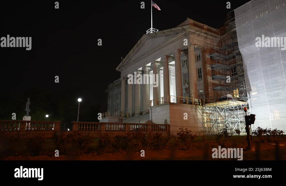 Front facade North side of the US Treasury Department at night with ...