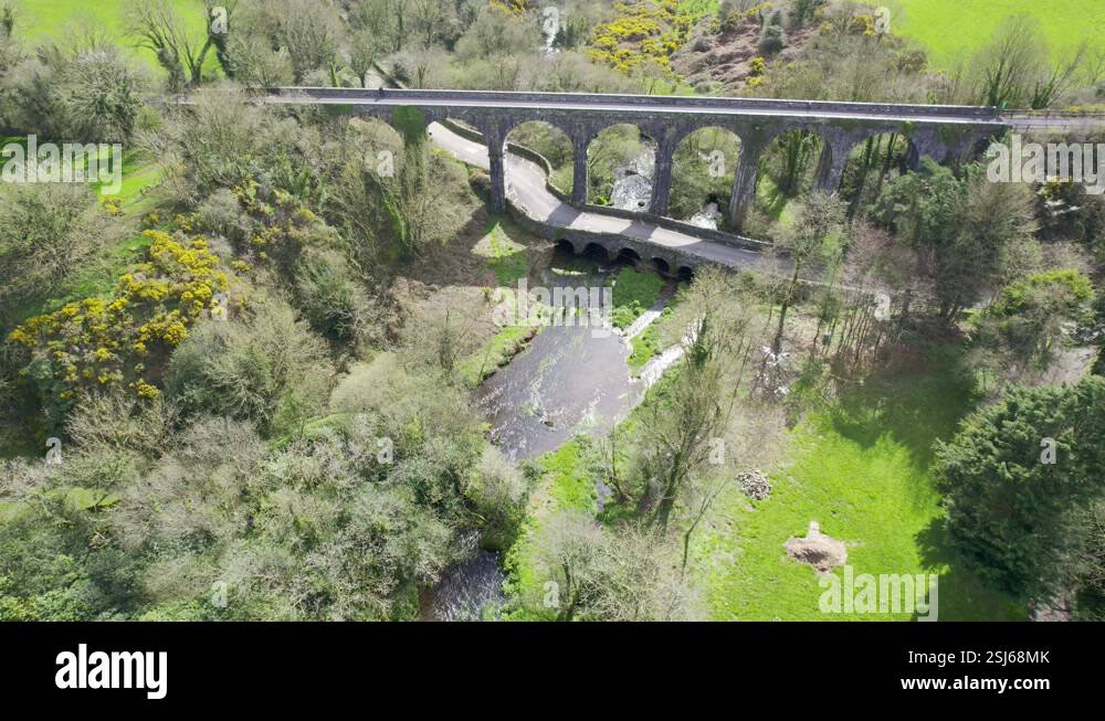 Viaduct over a Bridge Waterford Greenway Ireland cyclist pauses to take ...