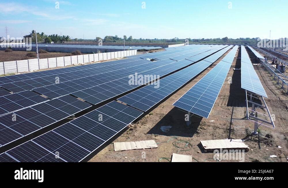 Photovoltaic power plant installation process. Solar panels in aerial ...