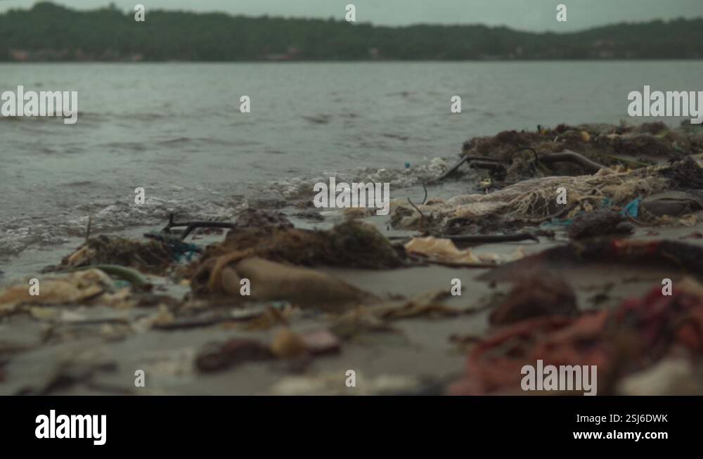 Ocean pollution with plastic waste. Sea beach with ecological garbage ...