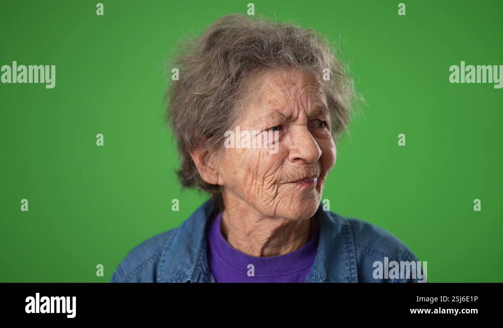 Slow motion closeup portrait of angry upset frustrated angry elderly ...