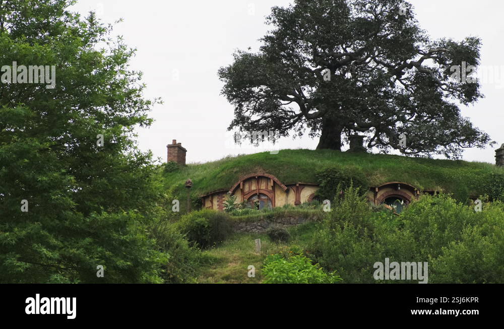 Majestic oak tree overlooking the Hobbit hole of Bag End in the ...