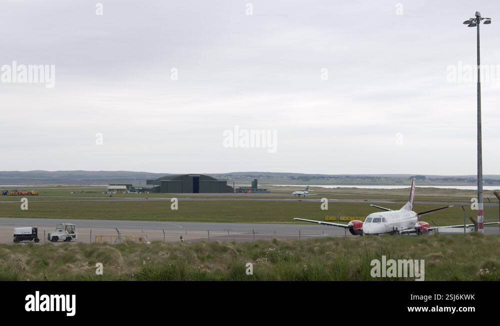 Shot of an airplane starting its engines after being loaded with ...
