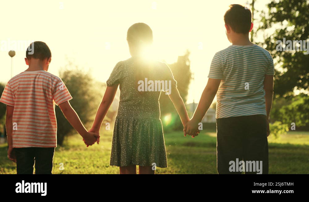 Childrens teamwork, group of children playing in park. Boy and girl ...