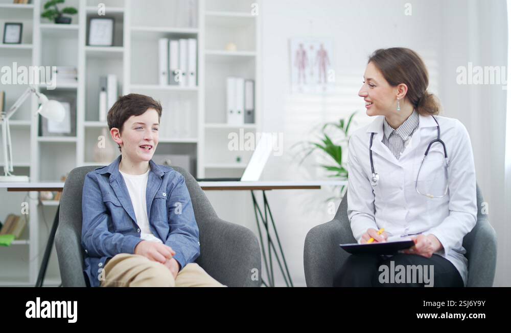 Child at a pediatrician appointment in office. Teen boy visit to the ...